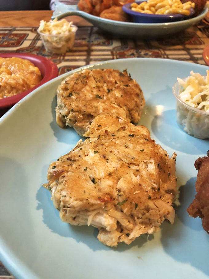 Crab cakes that look like they teleported straight from Chesapeake Bay – all meat, minimal filler, and absolutely zero regrets. 