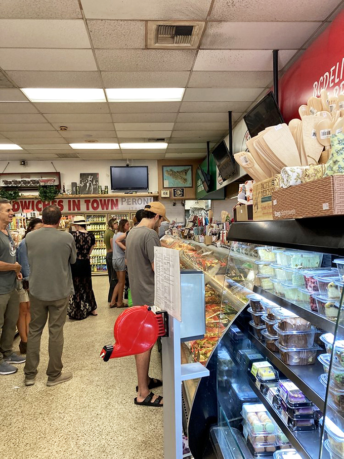 The line forms with purpose—each customer inching closer to sandwich nirvana with the patience of someone who knows good things come to those who wait.