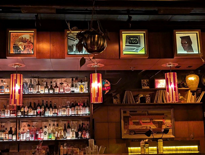 The spirits selection behind the bar tells stories of distilleries near and far. Those pendant lights could have been stolen from a 1970s recording studio, in the best possible way.