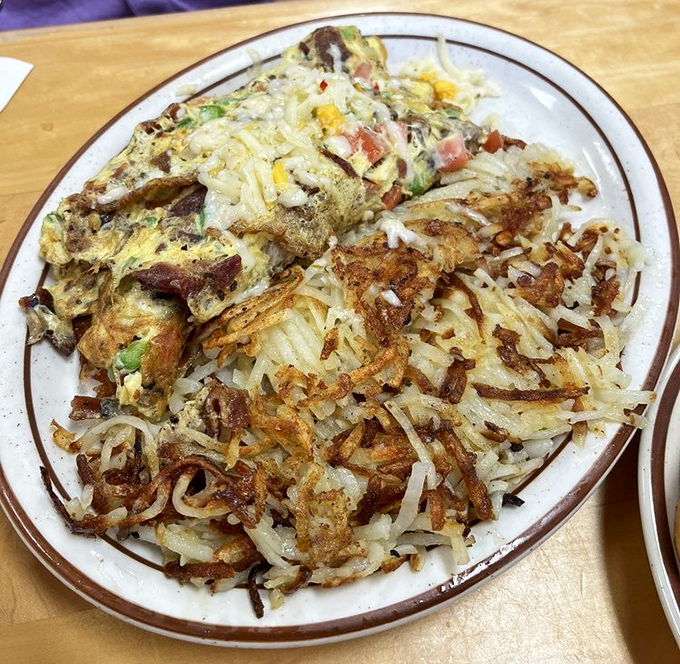 This Denver omelette with hash browns isn't trying to reinvent breakfast—it's reminding you why the classics became classics in the first place.