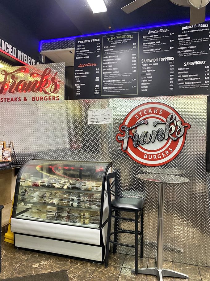 Where decisions are made and appetites are tested – Frank's menu board and logo stand as beacons of Philadelphia promise.