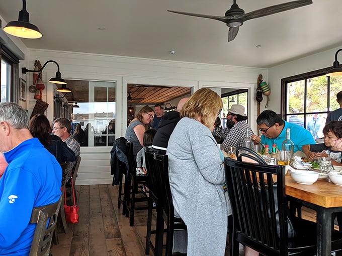 The dining room hums with the universal sound of seafood satisfaction—a chorus of "mmms" punctuated by the crack of crab shells.