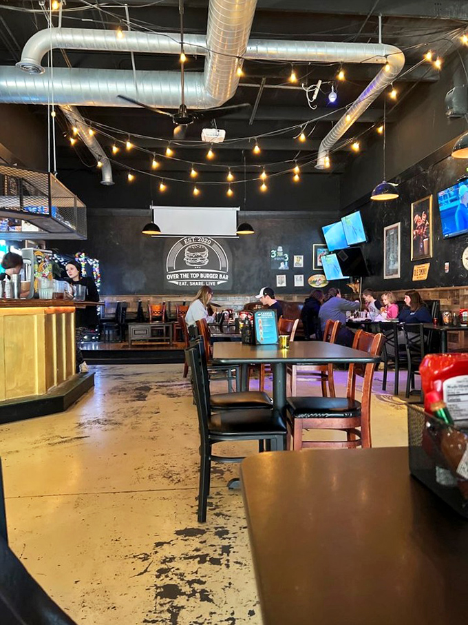 The natural habitat of burger enthusiasts in their element—plotting strategies to tackle towering creations without wearing half of them.