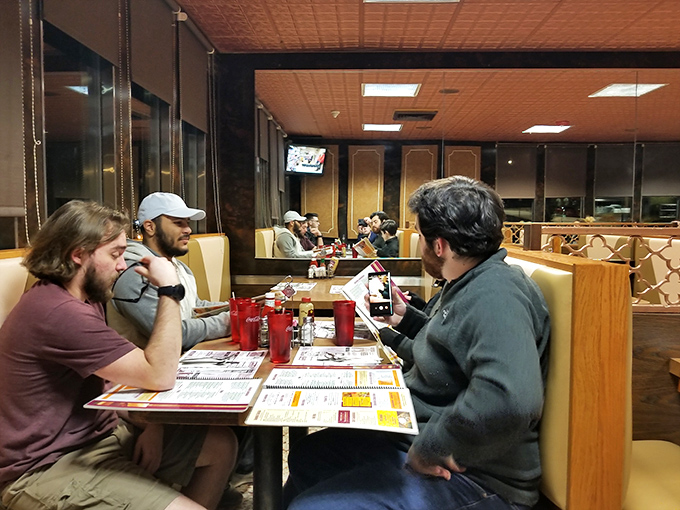 A snapshot of diner democracy in action – where conversations flow as freely as the coffee refills.