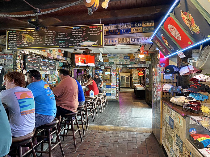 The bar scene—where strangers become friends over cold beers and fish tales that grow bigger with each round.