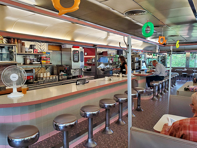 Morning light streams through windows as patrons claim their spots at the counter—a daily ritual as American as the coffee being poured.