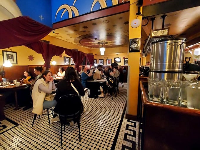 A bustling dining room where strangers become friends over ice cream martinis. That checkered floor has witnessed countless food epiphanies.