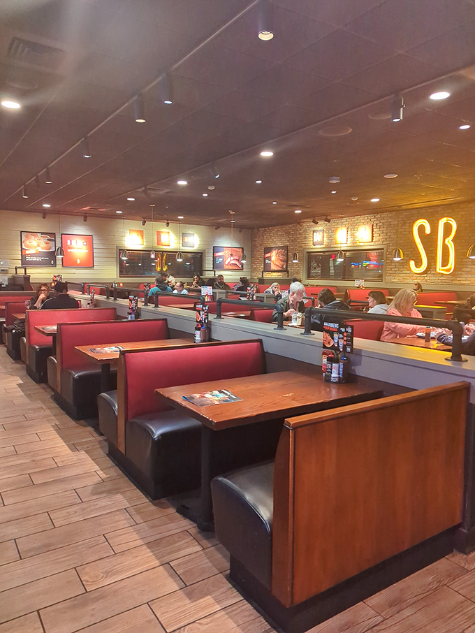 Red booths and wooden tables create that classic American restaurant feel—where conversations flow as freely as the barbecue sauce.