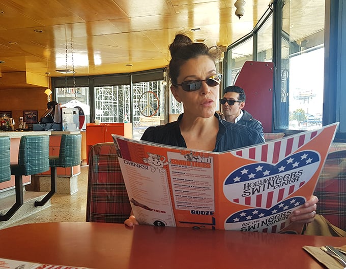 The menu deserves your full attention – those sunglasses aren't just a fashion statement, they're protection from the brilliance of breakfast possibilities.