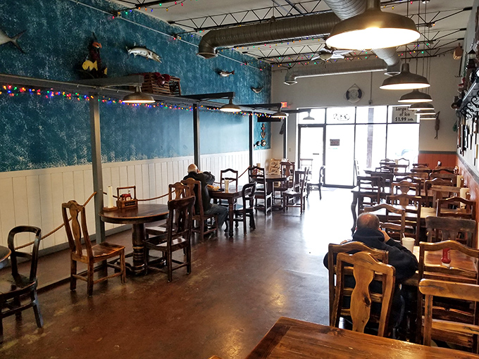 The dining room during a quieter moment—where wooden tables await the next round of seafood enthusiasts seeking their fish and chips fix.