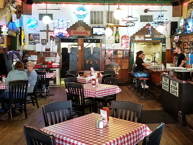 Red and white checkered tablecloths – the universal signal that you're about to eat something honest, unpretentious, and deeply satisfying.