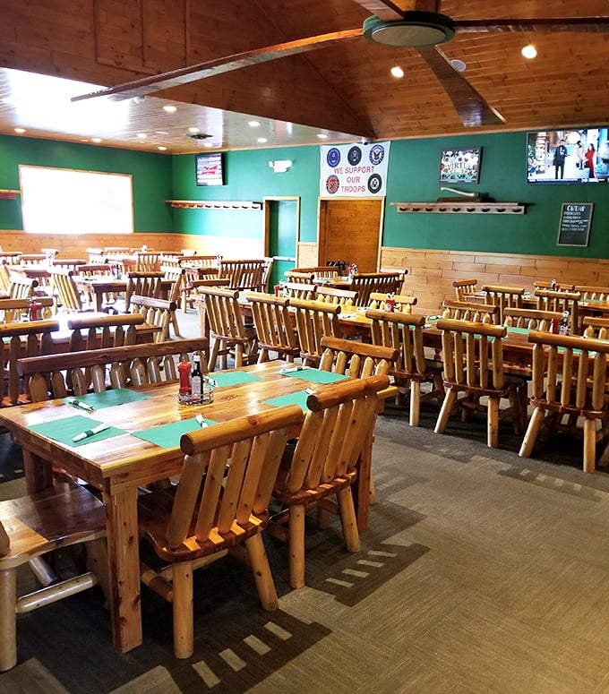 Empty tables waiting for the dinner rush—each log chair silently promising "the most comfortable food coma of your life."
