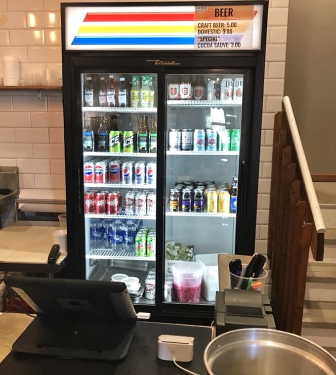 Cold beverages waiting to meet hot barbecue—a match made in heaven. That craft beer selection knows exactly what your brisket wants.