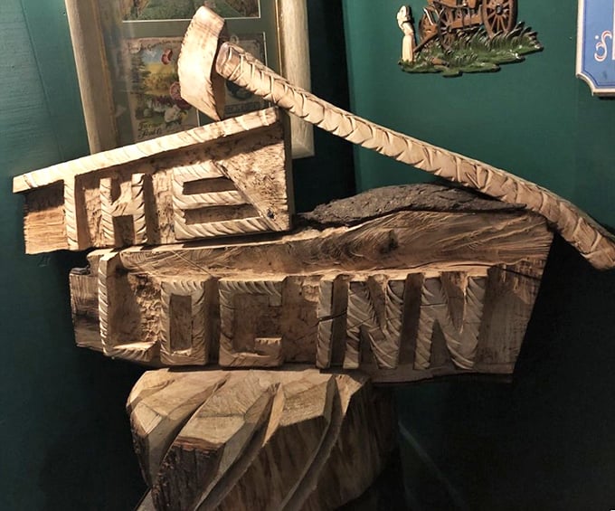Hand-carved wooden sign that's as authentic as the food. No neon, no flash—just like the honest cooking that keeps people coming back.