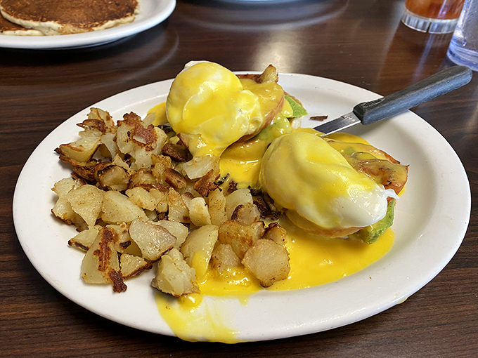 Eggs Benedict that would make a brunch snob weep with joy—perfectly poached eggs draped in hollandaise that practically glows.