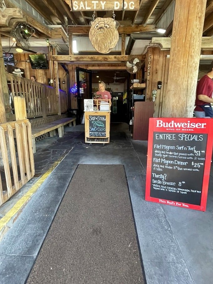 That carved wooden dog hanging above the entrance isn't just decoration—it's the guardian of good times and great meals to come.