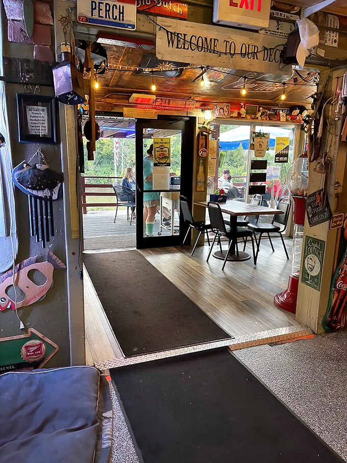 The doorway between indoor comfort and outdoor splendor, marked by a sign that simply states the obvious: "Welcome to our deck."