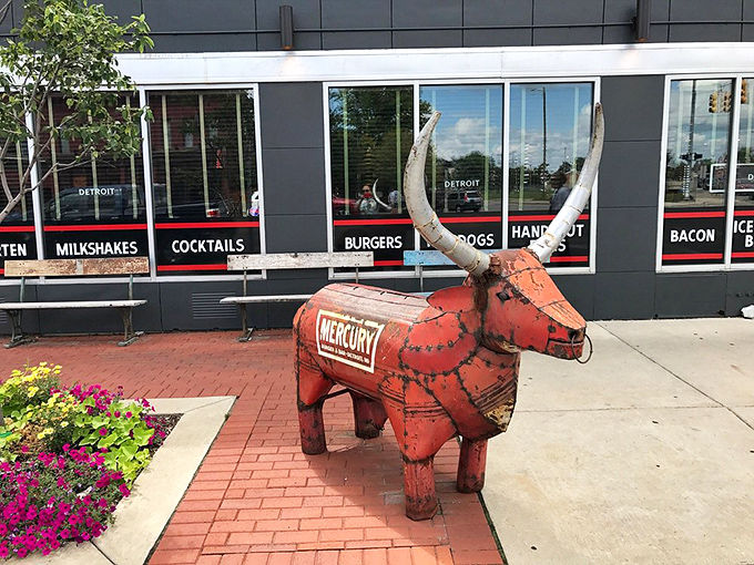 This isn't just metal yard art—it's Mercury's unofficial mascot, greeting hungry visitors with a quirky charm that says "Detroit" in the best possible way.