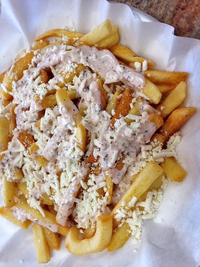 Feta fries: where Mediterranean meets comfort food in a glorious union that makes you wonder why this isn't on every menu in America.