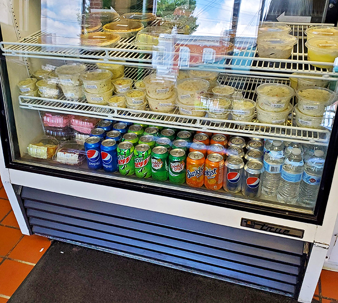 The refrigerated case offers sides and drinks, a supporting cast of characters for the star of the show—that legendary chicken.