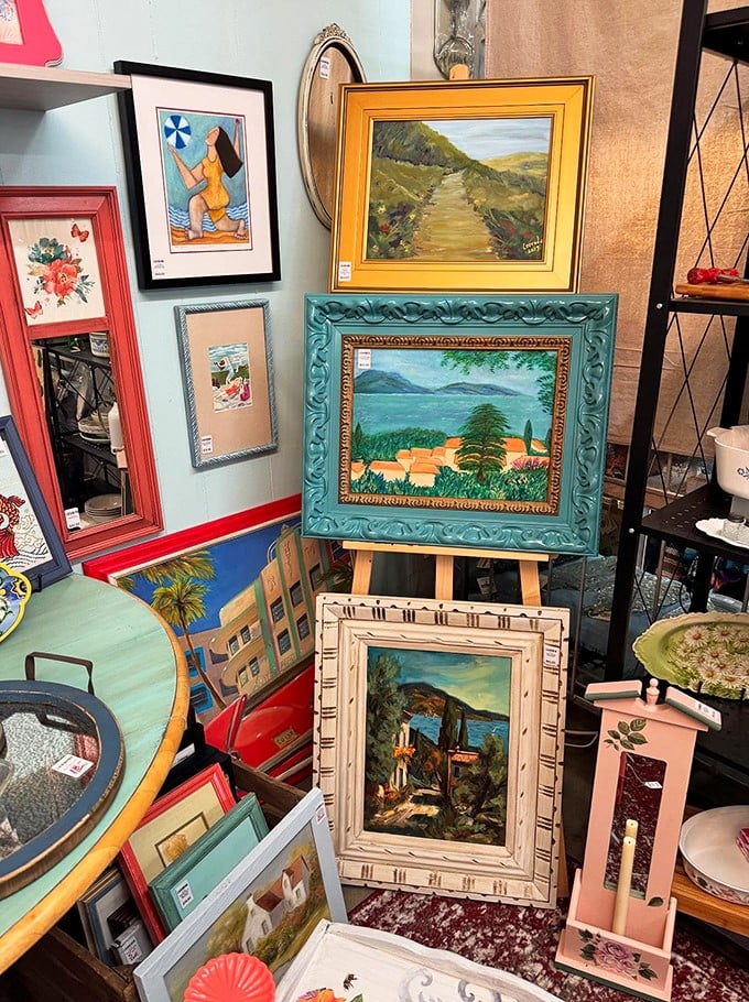 Framed artwork waiting for second chances. These paintings have already survived several decades of changing design trends—they'll outlast your latest Pinterest phase too.