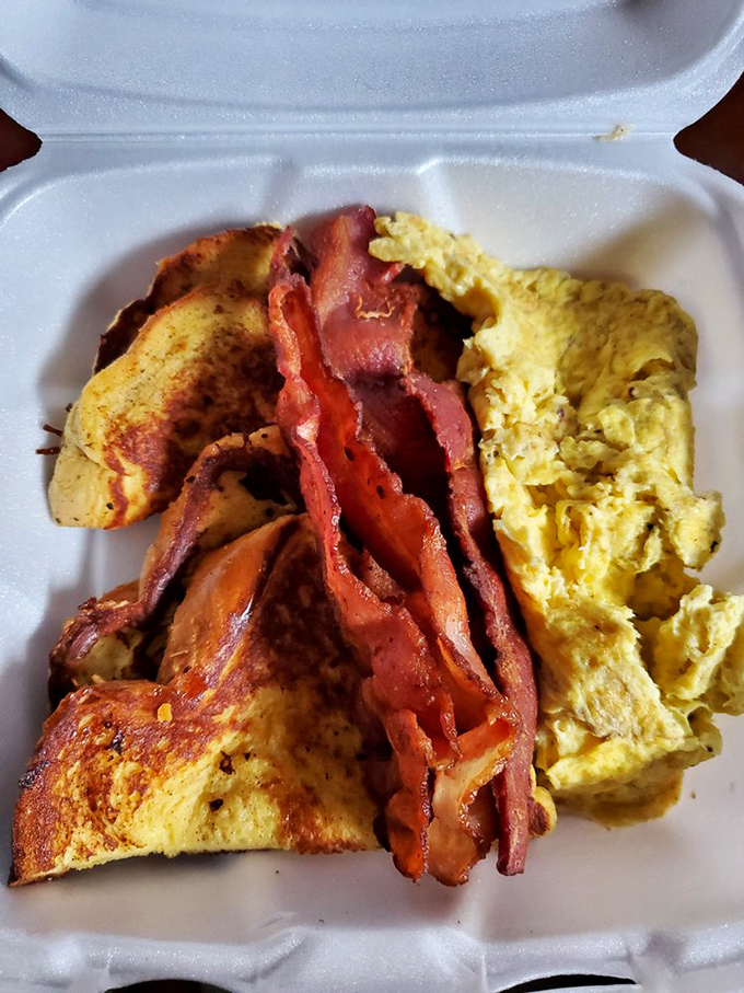 French toast and bacon in a takeout container – proof that happiness can indeed be purchased for less than $10.