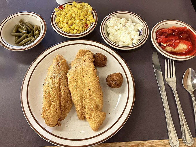 Fried catfish with a cornmeal crust so perfect it should have its own Instagram account. Those sides aren't just accompaniments – they're co-stars.