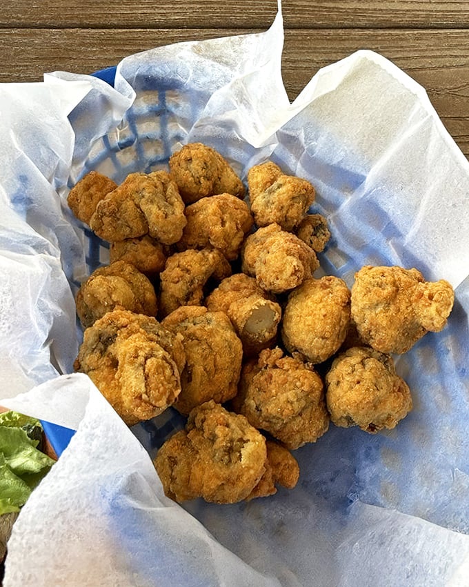 Mushroom magic in every bite. These golden-fried fungi offer earthy delights beneath their crispy coating – the perfect shareable starter.