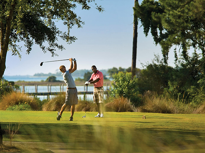 Golf with a water view—because missing a putt feels less painful when dolphins might be watching.