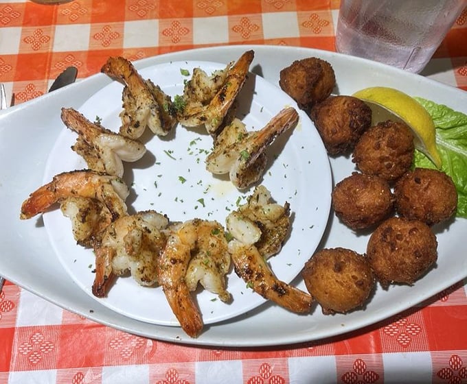 Perfectly grilled shrimp alongside golden hushpuppies – a plate that respects tradition while respecting your taste buds even more.