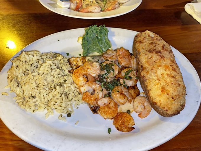 Grouper Destin showcases why this local fish deserves star treatment – flaky perfection topped with shrimp and that signature sauce.