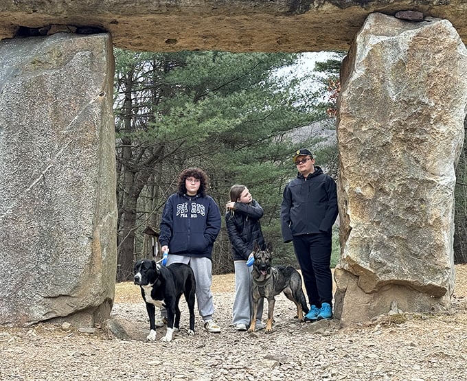 Even the dogs seem to understand they're standing in a magical doorway, though they're probably just hoping for treats.