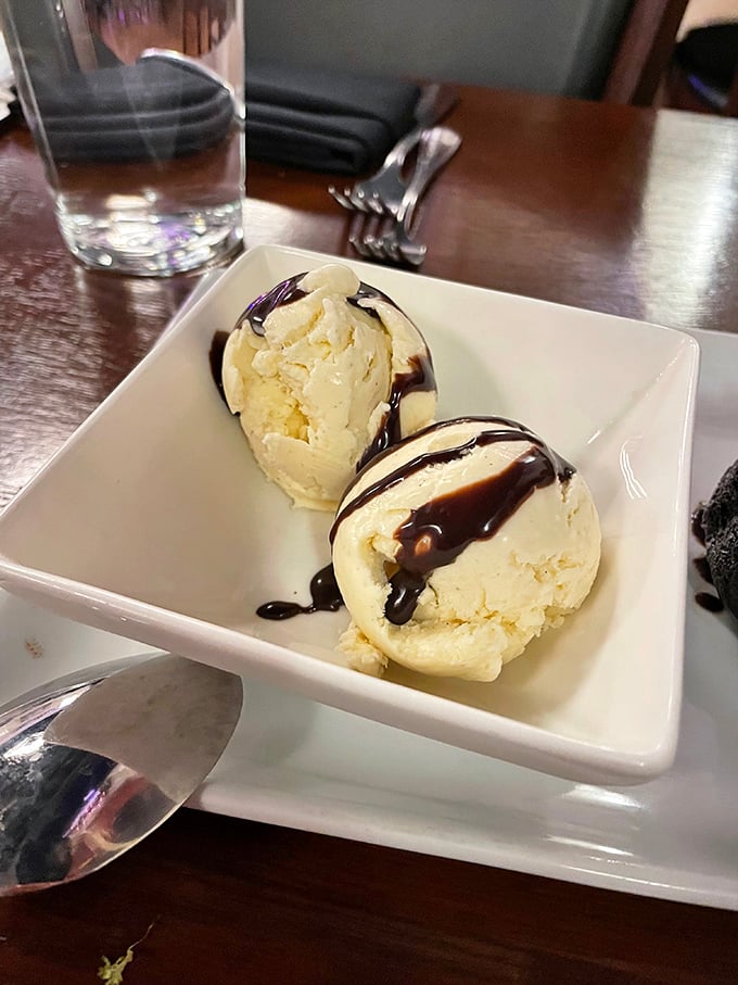 Two scoops of vanilla ice cream with chocolate sauce—proof that even the classics receive respectful treatment at Guerrera.