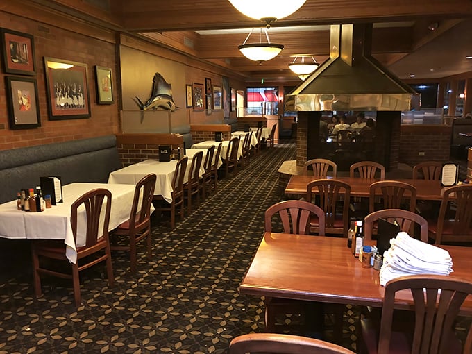 Classic white tablecloths and wood-paneled walls create the kind of dining room where your grandfather would nod approvingly while ordering his favorite cut.