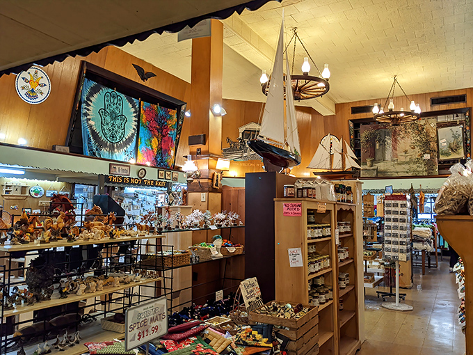 Model ships and colorful tapestries hang from the ceiling, creating a whimsical backdrop for serious souvenir shopping.