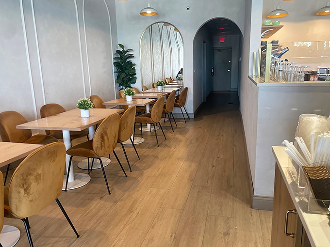 Caramel-colored chairs invite you to settle in with your coffee and pastry. This corner was designed for lingering conversations and second helpings.