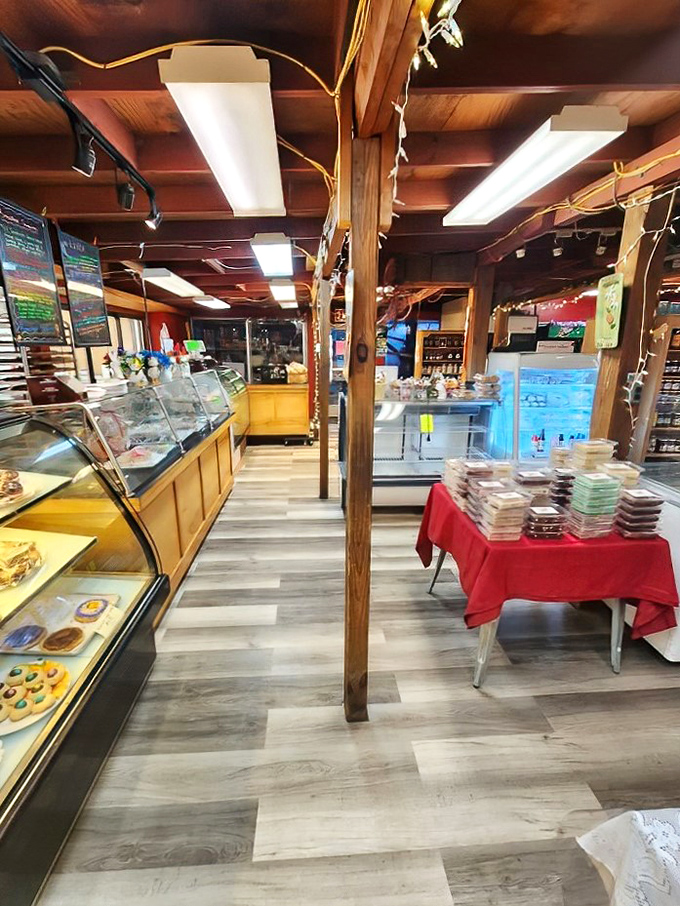 Wooden beams and display cases create a rustic charm that whispers, "Stay awhile and try everything – diet starts tomorrow."
