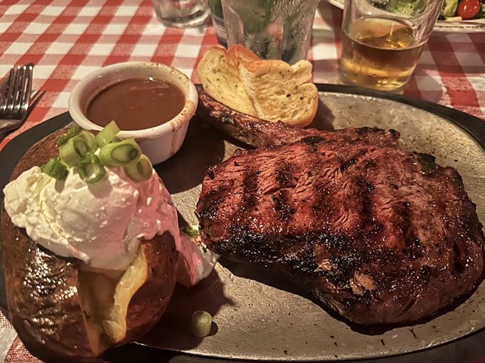 A perfectly charred ribeye with a loaded baked potato. The steakhouse equivalent of a greatest hits album—every track a winner.