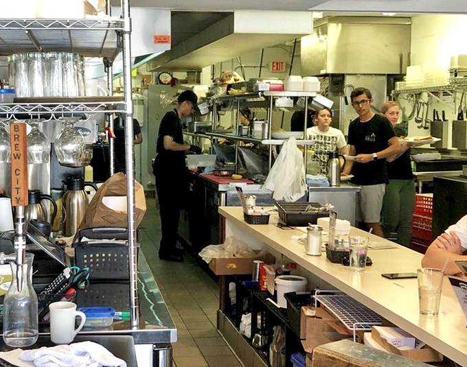 The kitchen hums with purpose – this is where the magic happens, one perfectly fried fish at a time.