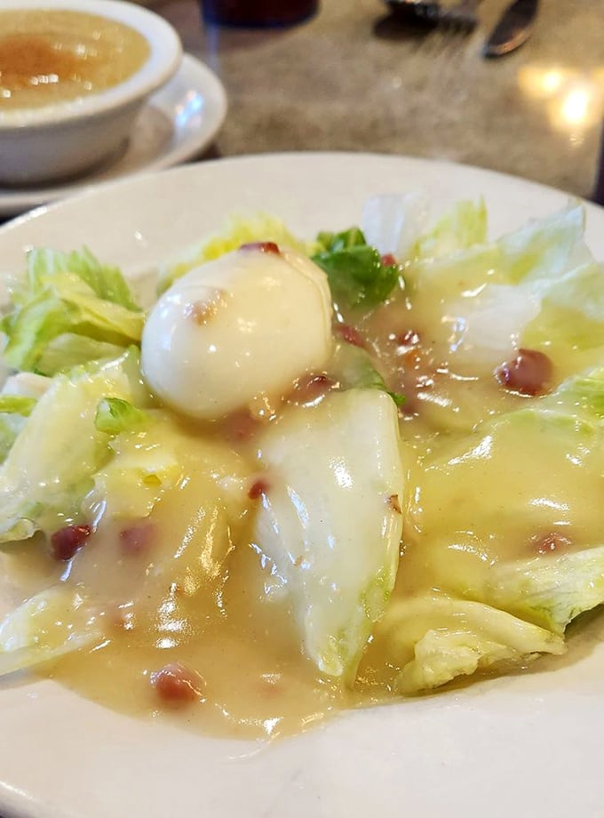 A salad that's clearly just visiting the diner menu – light, refreshing, and wondering how it ended up surrounded by all these comfort food heavyweights.