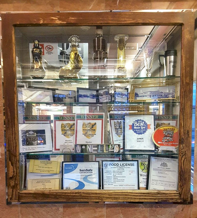 A trophy case of well-earned accolades—each award representing thousands of perfectly executed pancakes and satisfied customers.