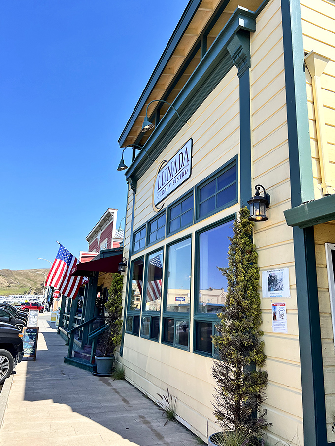 Lunada Garden Bistro's crisp white exterior and American flag offer a quintessential slice of small-town coastal dining—no reservations app required.