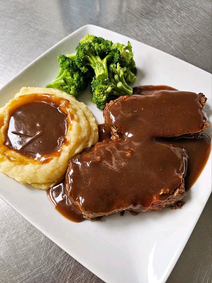 Meatloaf and mashed potatoes swimming in rich gravy – the kind of plate that makes you want to call your mother and apologize for ever complaining.