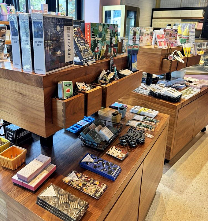 The merchandise corner offers take-home treasures—because when the dessert memory fades, a Glass Knife puzzle or cookbook keeps the sweet connection alive.
