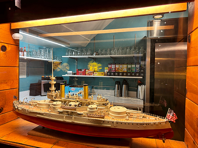 Not just decoration—this miniature battleship model represents the attention to detail that extends to everything they serve.