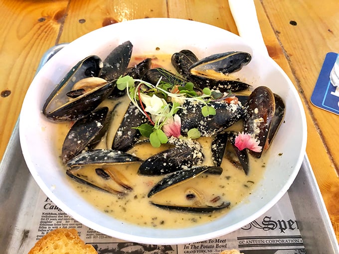 These mussels aren't just swimming in sauce – they're doing the backstroke in a pool of garlicky, buttery heaven.