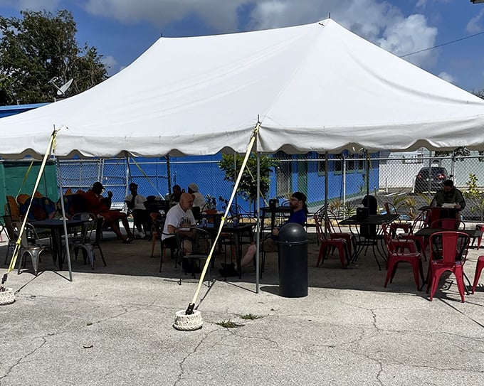 The tent creates a communal dining experience where strangers become friends united by their love of exceptional seafood.