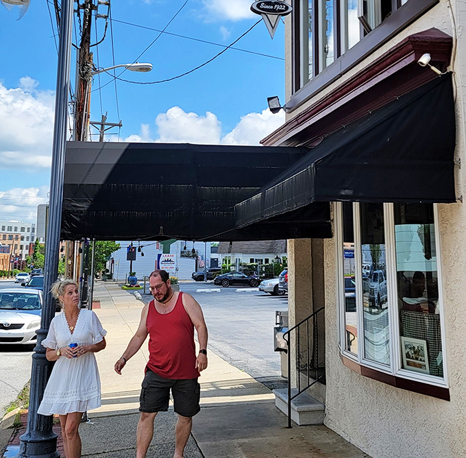 The sidewalk outside Kozy Korner—where satisfied customers emerge with that unmistakable "I just had the perfect breakfast" glow.