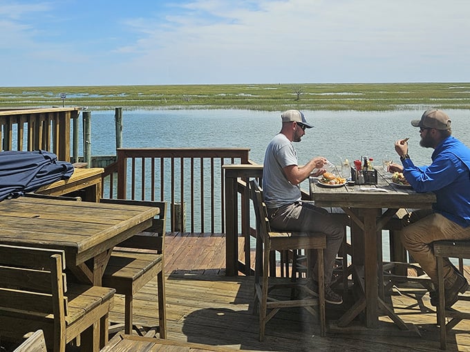 Waterfront dining that makes you wonder why you ever eat indoors—where lunch comes with a side of endless marsh views.