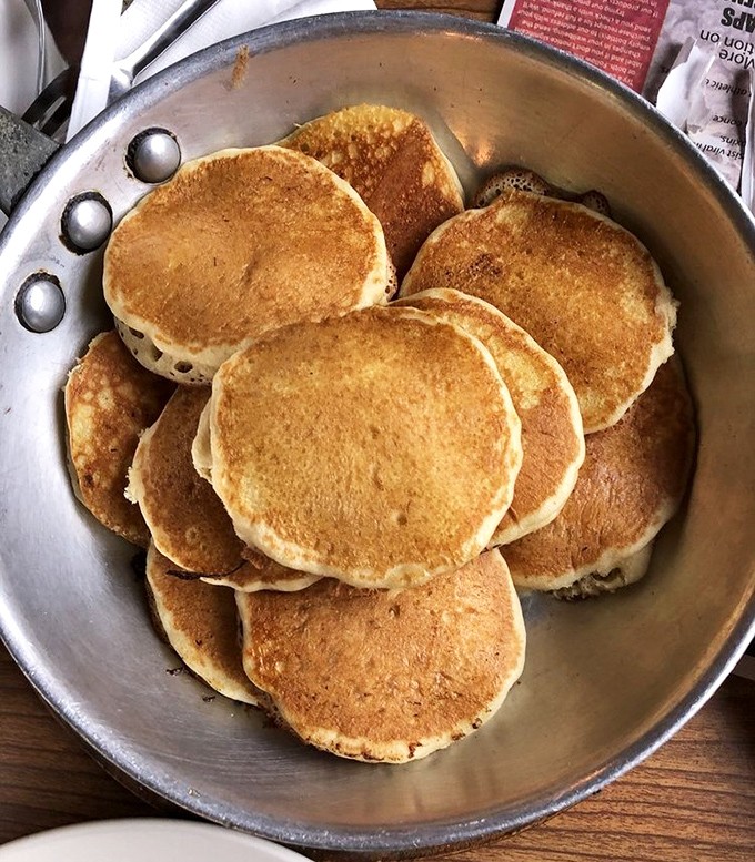 A symphony of golden circles in a simple metal pan. Sometimes, all you need are good pancakes, plain and simple.